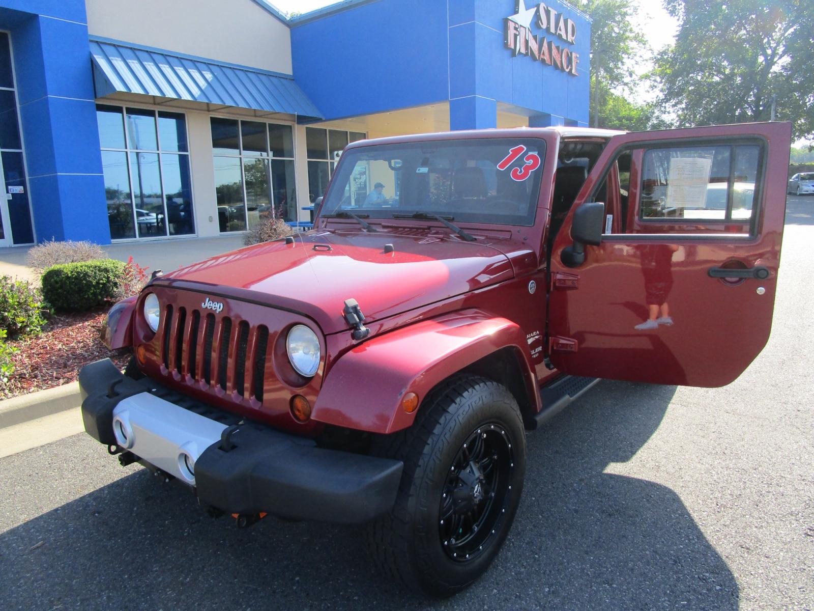 Lloyd's Auto Sales - 2013 Jeep Wrangler Unlimited Sahara 4WD